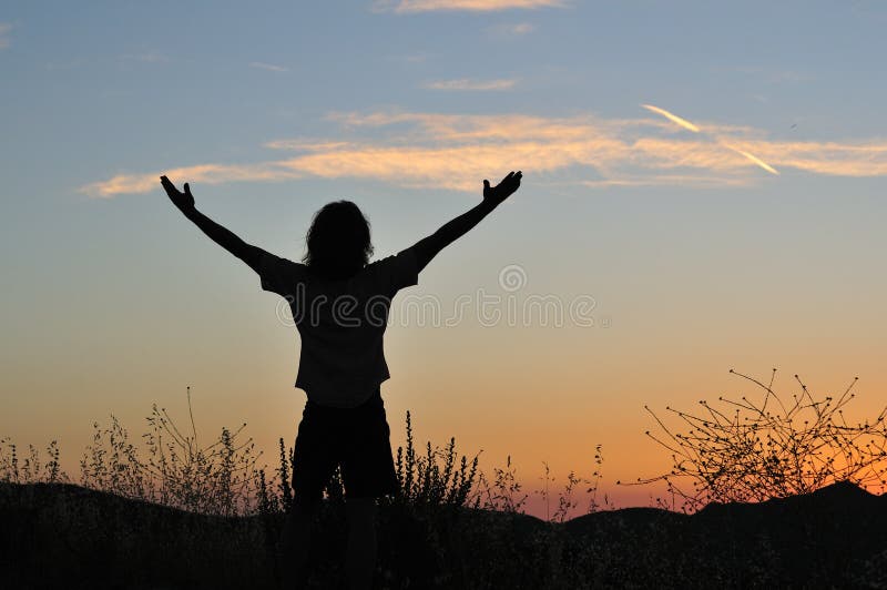 Triumphant Man at Sunset - Horizontal Stock Image - Image of nature ...