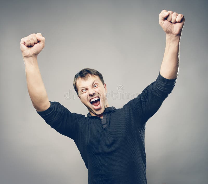 Triumphing young man stock image. Image of human, people - 27893465