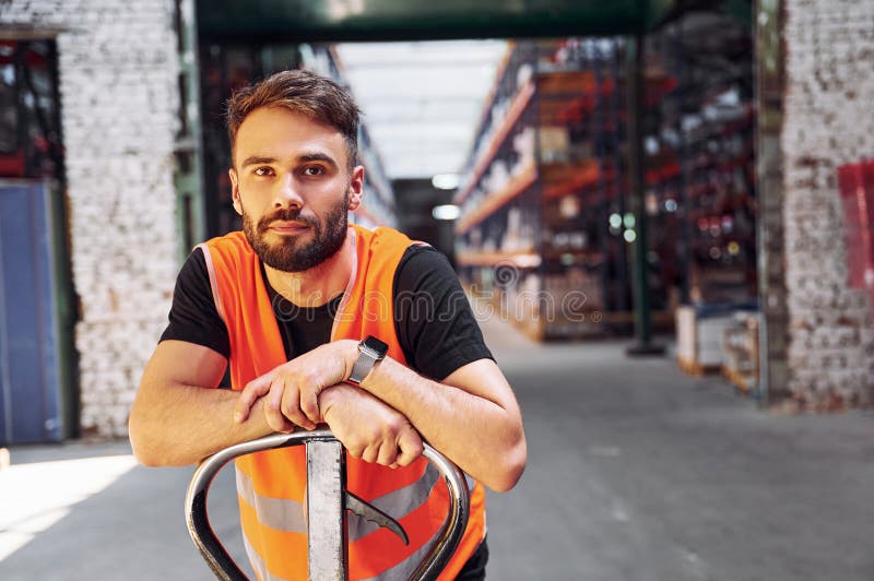 Trolley Platform. Storage Worker is in the Warehouse with Bunch of ...