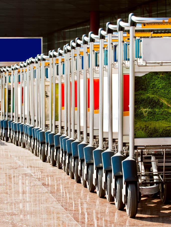 Lined Up Trolleys At Airport. Baggage Trolleys At The Airport. Stock ...