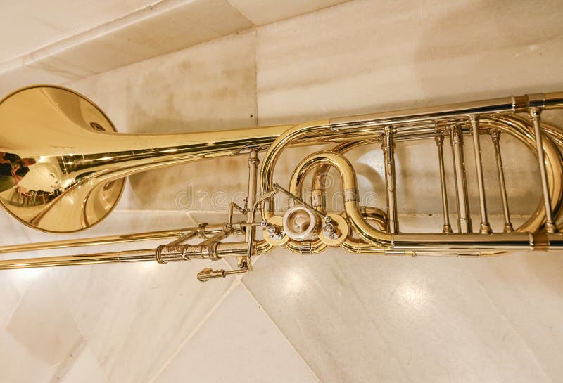 Trombone, Air Musical Instrument Resting on the Marble Floor. Stock ...