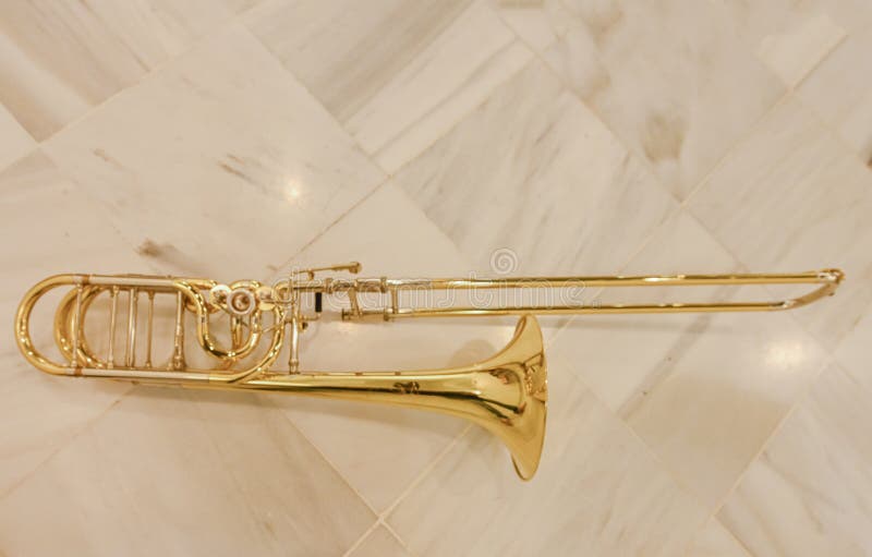 Trombone, Air Musical Instrument Resting on the Marble Floor. Stock ...