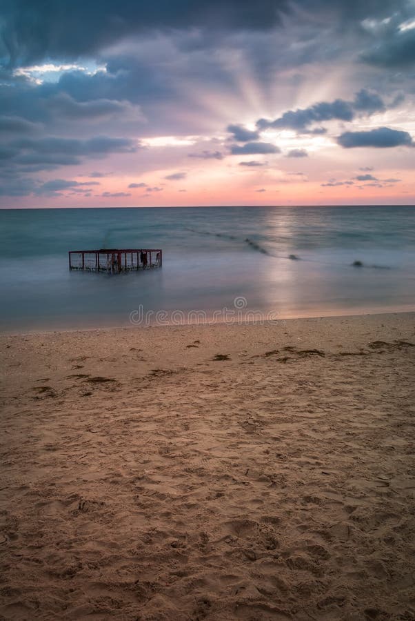 Tropical Beach with Empty Cage in the Sea at Sunset Stock Image - Image ...
