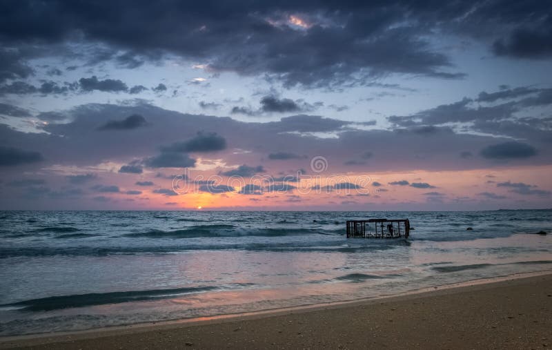 Tropical Beach with Empty Cage in the Sea at Sunset Stock Photo - Image ...