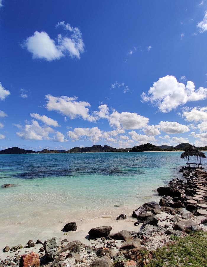 Tropical Beach with Path into Water, View of Island in Distance Stock ...