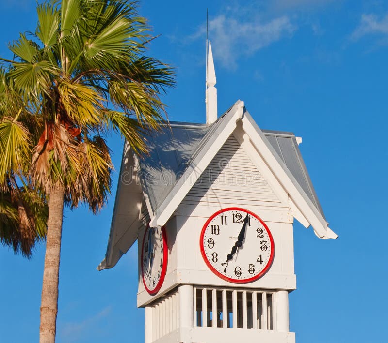 Tropical Clock Tower stock photo. Image of piece, palm - 118640420