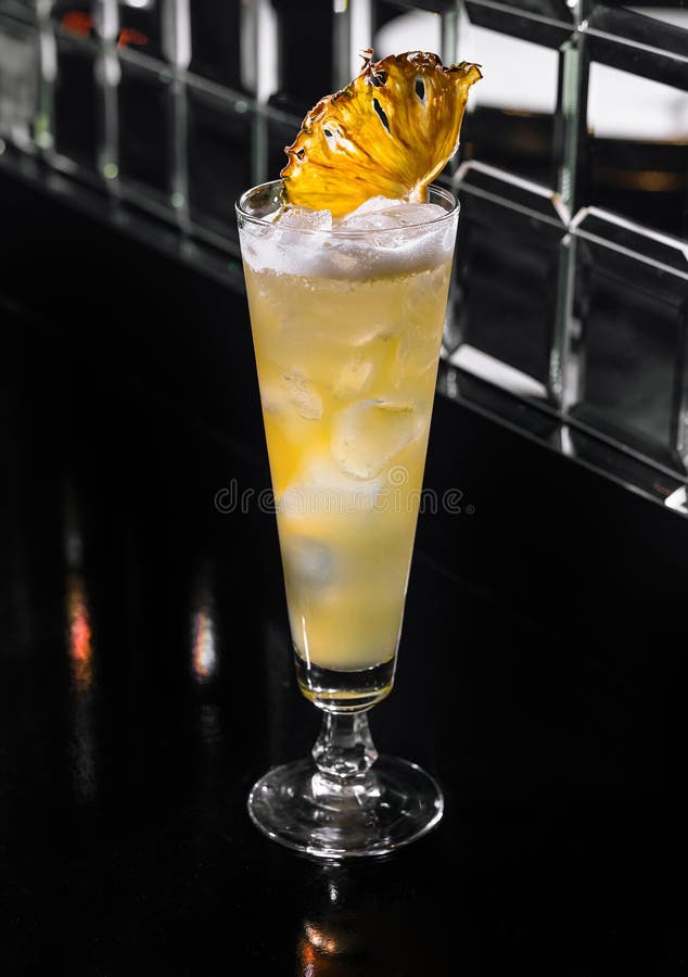Tropical Cocktail with Pineapple Garnish Stock Image - Image of elegant ...