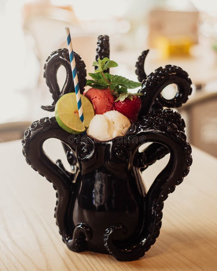 Tropical Cocktail of Rum and Fruit Ice Cream Served in an Octopus ...