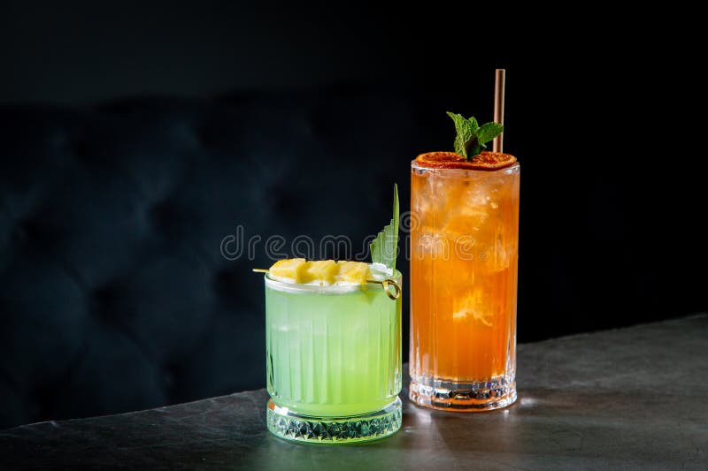 Tropical Cocktail with Sunset Gradient and Citrus Side View Stock Photo ...