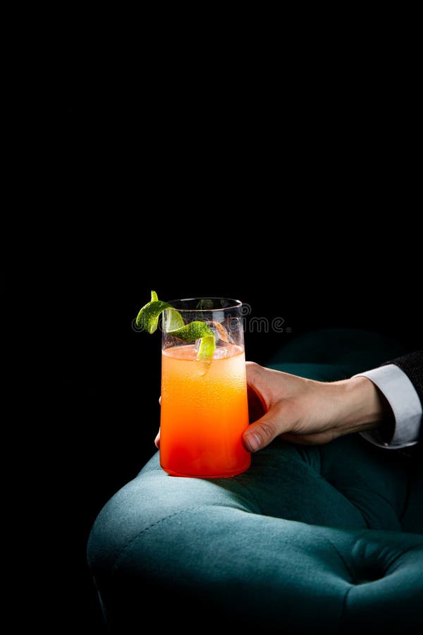 Tropical Cocktail with Sunset Gradient and Citrus Side View Stock Photo ...
