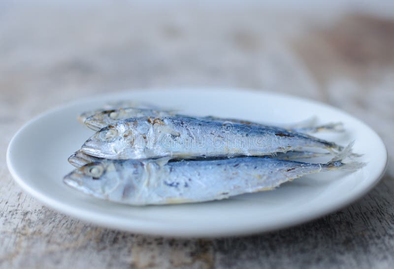 Tropical Fried Fish on a White Dish Stock Photo - Image of kitchen ...