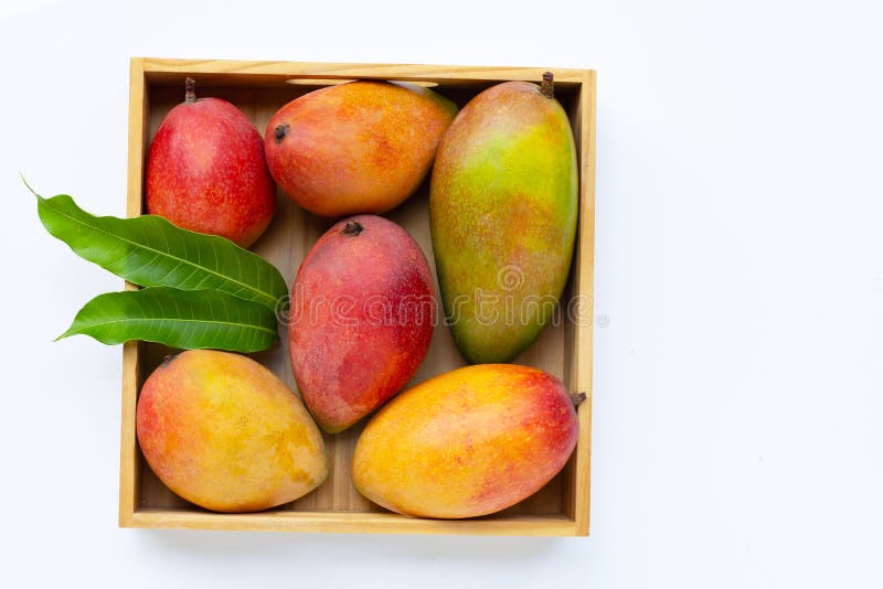 Tropical Fruit, Mango with Green Leaves in Wooden Box on White Stock ...