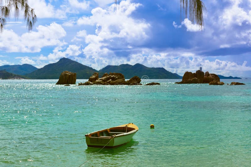 Tropical island and boat stock photo. Image of destinations - 44934034