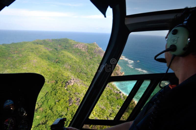 Helicopter on Scenic Flight with Clouds and Blue Sky Editorial Stock ...