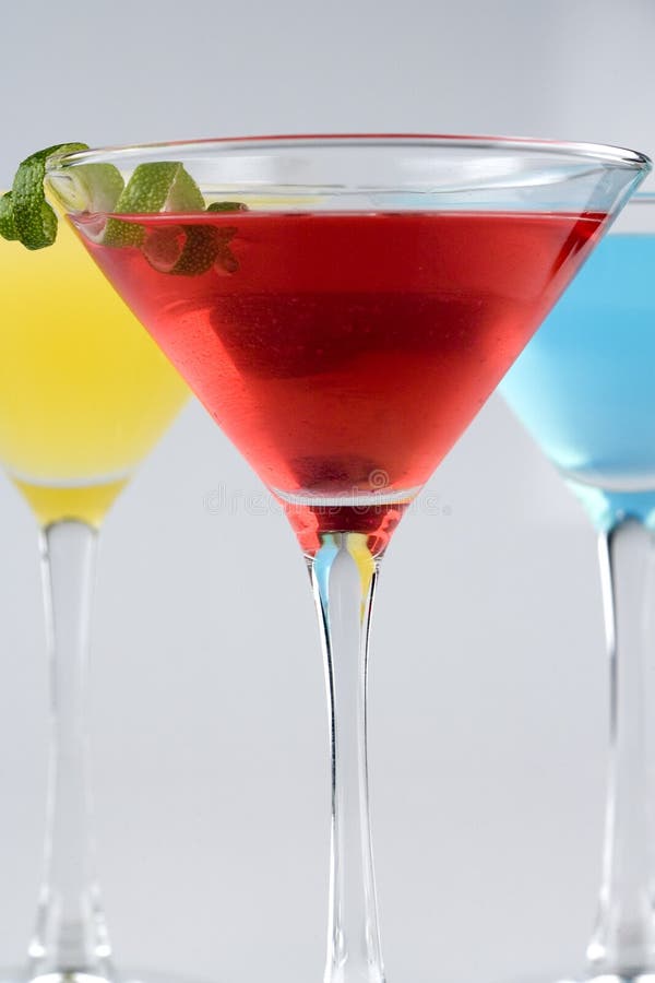 Tropical Martini Style Drinks with Fruit & Garnish Stock Photo - Image ...
