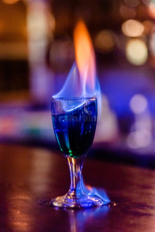 Beautiful Cocktail Burning with Fire on the Bar Table Stock Image ...