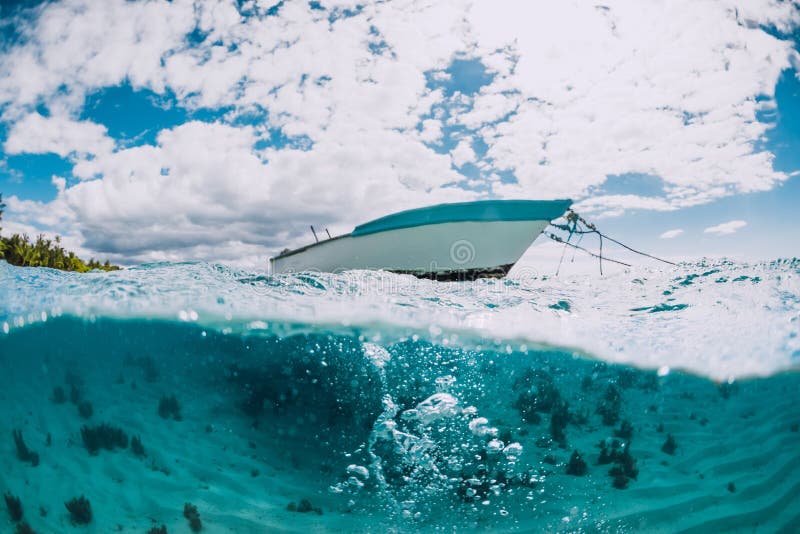 Tropical Ocean with White Boat in Mauritius. Split View with Bubbles in ...