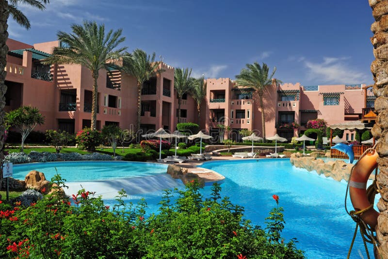 Tropical Resort Hotel with Beautiful Pool in Foreground. Stock Photo ...