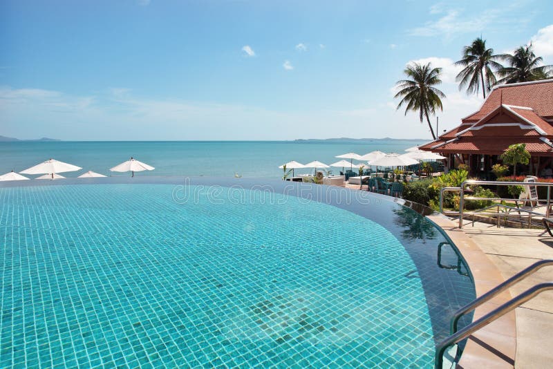 Tropical Resort. Poolside and Sea View Stock Photo - Image of hotels ...