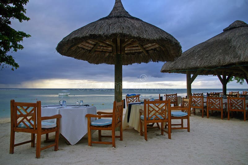 Tropical Restaurant Tables on Beach at Sunset Stock Image - Image of ...