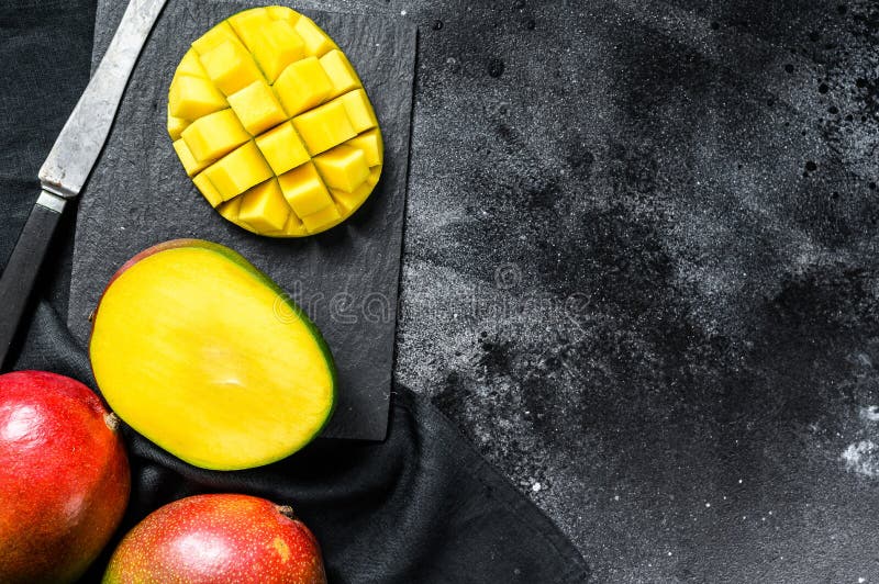 Tropical Ripe Mango Fruit. Black Background. Top View Stock Photo ...