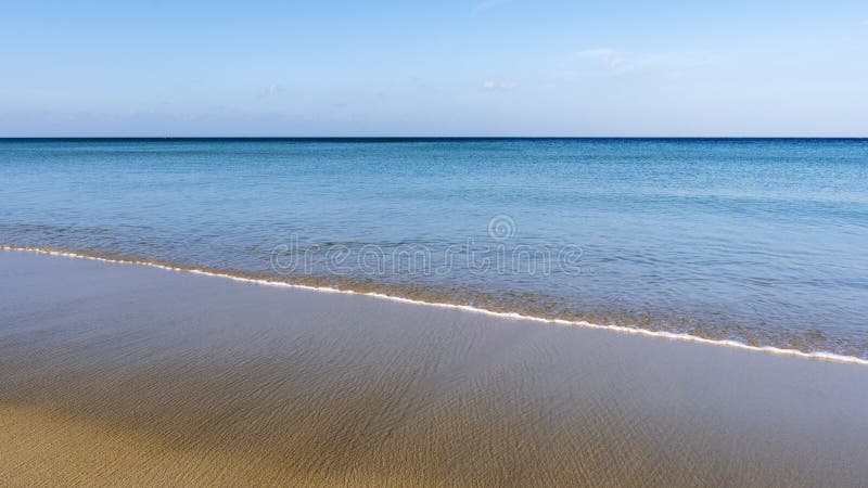 Tropical Sandy Beach with Blue Sky and Wave Crashing on Sandy Shore ...