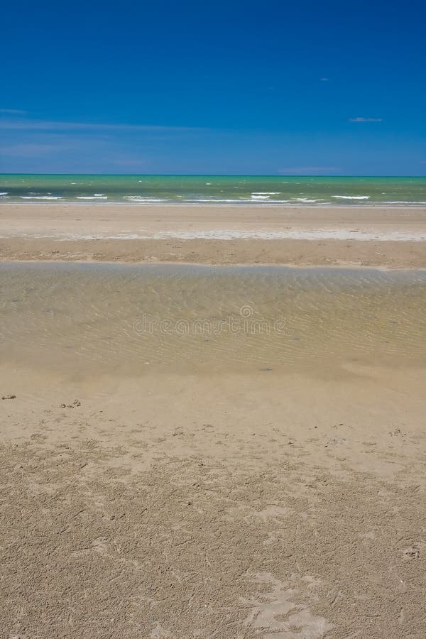 A Tropical Seaside with Sandy Beach, Blue Sky and Stock Photo - Image ...