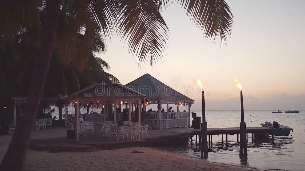 Tropical Sunset Beach Bar; Diners Enjoy Ocean View Stock Photo - Image ...