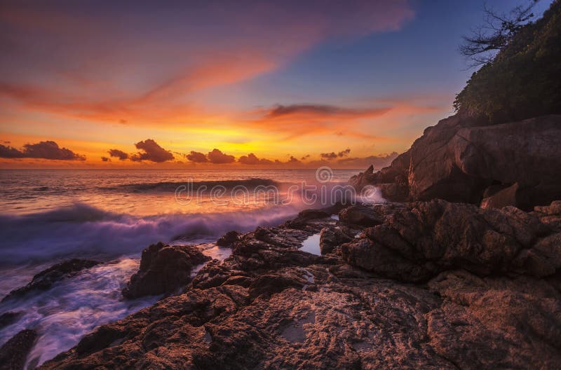 Tropical sunset at beach stock photo. Image of orange - 174237408