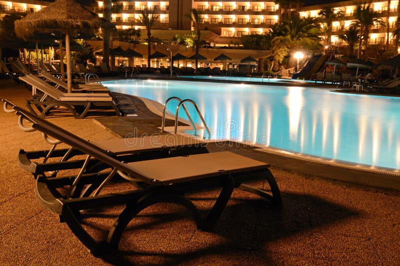 Tropical Swimming Pool by Night Stock Photo - Image of parasol, beauty ...