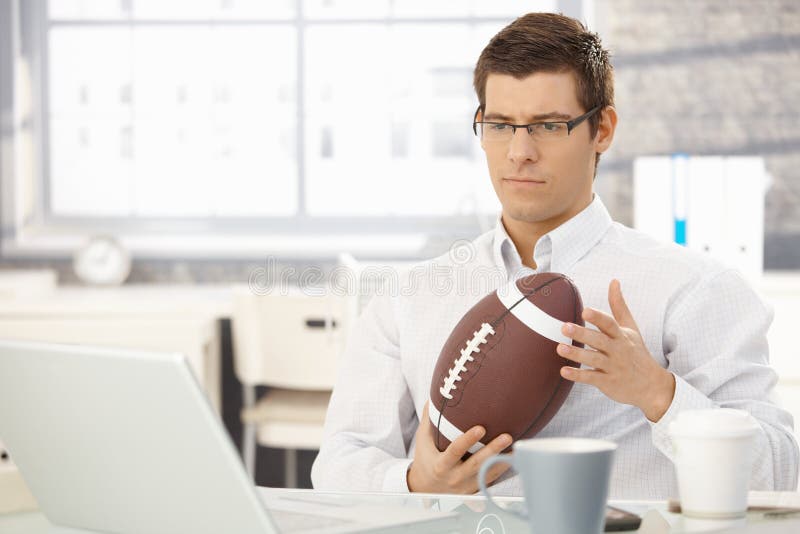 Troubled Businessman Thinking Holding Football Stock Photo - Image of ...