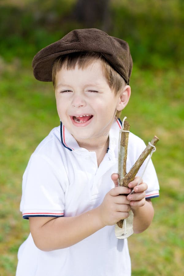 Troublemaker. Boy with Slingshot Stock Image - Image of making, playful ...