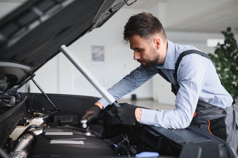 Troubleshooting Process. Auto Mechanic Working in Garage Stock Image ...