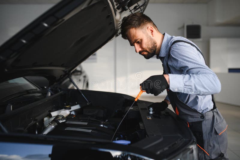 Troubleshooting Process. Auto Mechanic Working in Garage Stock Image ...