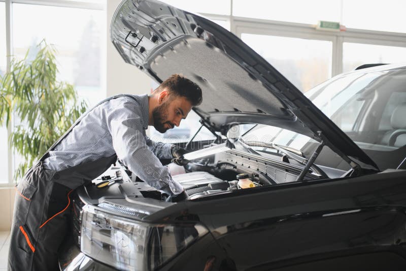 Troubleshooting Process. Auto Mechanic Working in Garage Stock Image ...