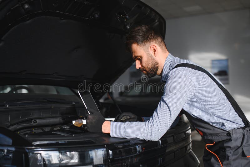Troubleshooting Process. Auto Mechanic Working in Garage Stock Image ...