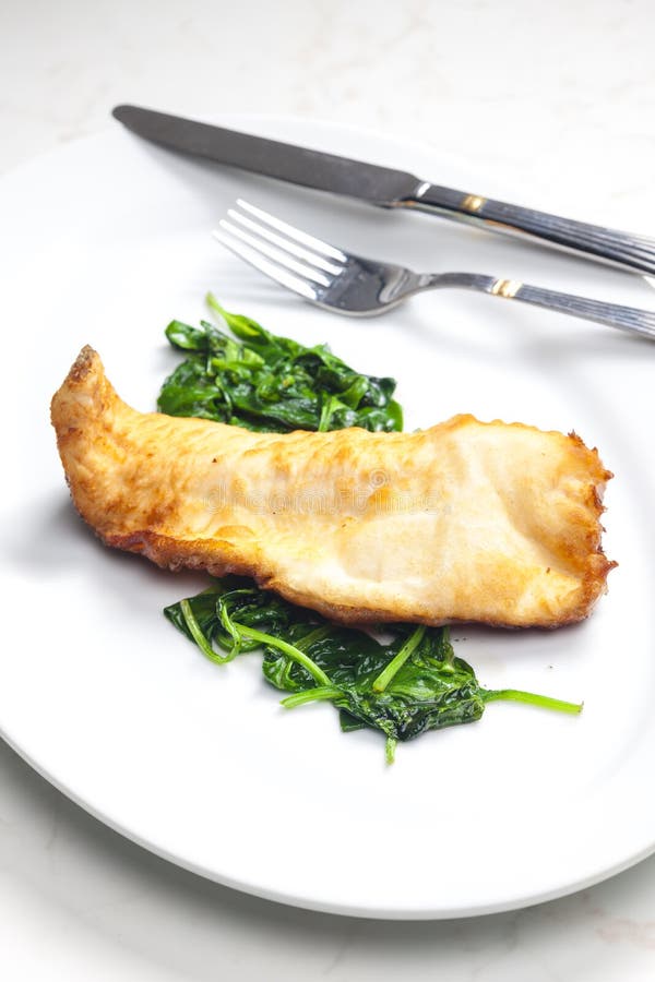 Trout in beer batter stock photo. Image of knife, spinach - 170022170