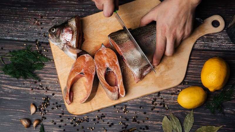 Trout on the Board, Which Cuts a Man Cook with a Knife. Fresh Raw Red ...