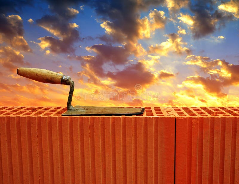 Trowel on Brick Wall in Sunset. Stock Photo - Image of industry, trowel ...