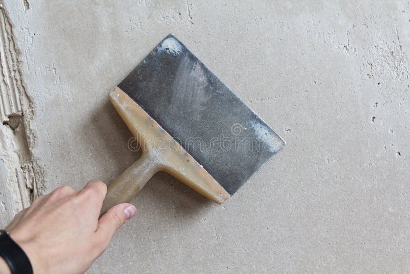 Trowel in a hand stock photo. Image of refit, working - 27444522
