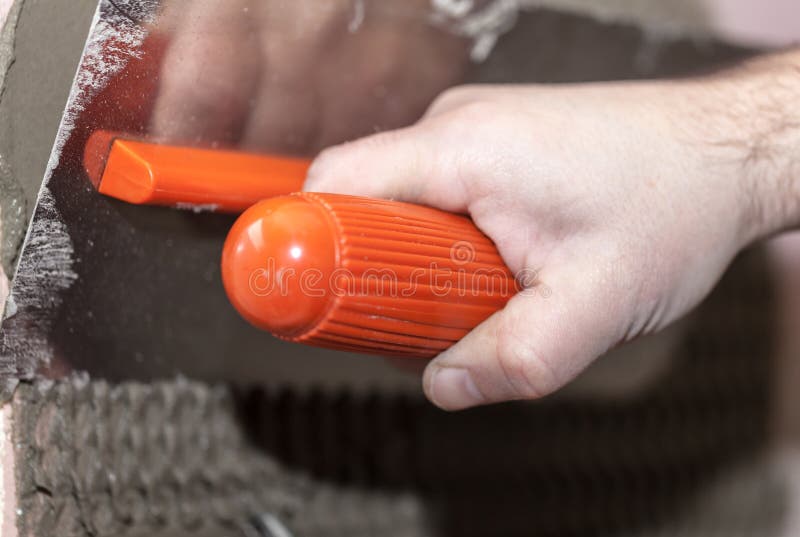 Trowel in a man hand stock image. Image of renovation - 90647011