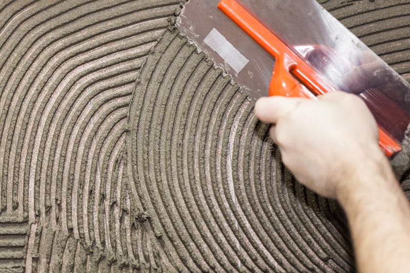 Trowel in a man hand stock image. Image of ceramic, concrete - 90647029