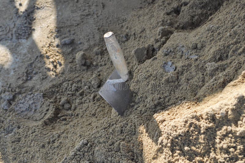 Trowel in the Sand in a Construction Site Stock Image - Image of tool ...
