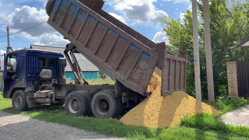 A Truck Brought Sand for the Construction Site. Bulk Cargo Delivery ...