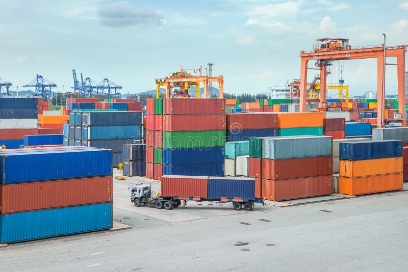 Truck Carries Container To Warehouse Near the Sea Stock Photo - Image ...