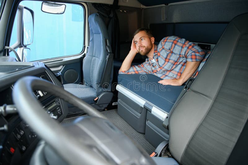 Truck Driver Sleeping on Bed Inside Truck Cabin Interior. Trucker ...
