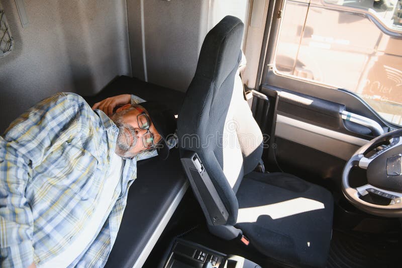 Truck Driver Sleeping on Bed Inside Truck Cabin Interior. Trucker ...