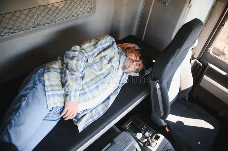 Truck Driver Sleeping on Bed Inside Truck Cabin Interior. Trucker ...
