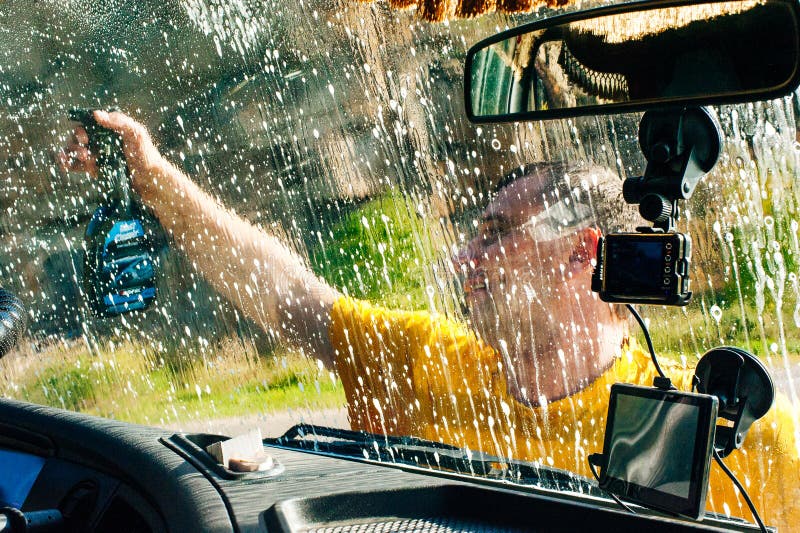 Truck Driver Washes a Windshield on the Road Stock Photo - Image of ...