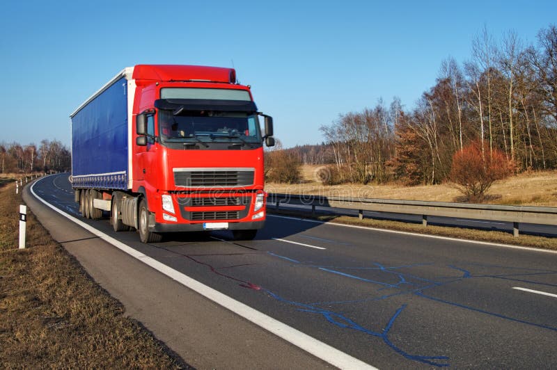 Truck Driving Along a Highway in the Countryside Stock Photo - Image of ...